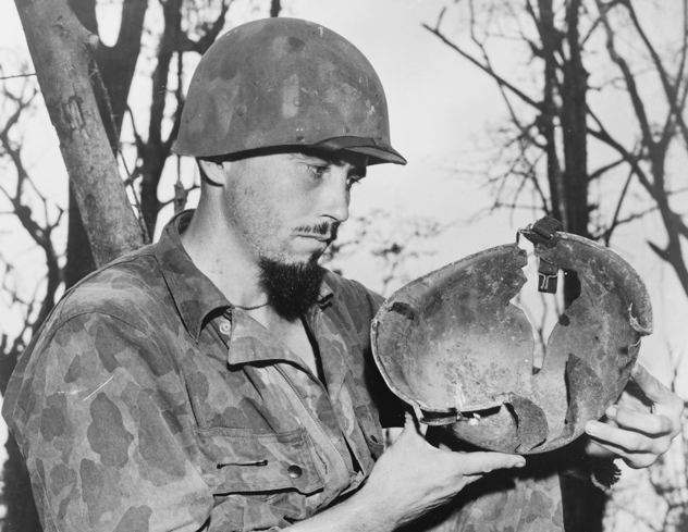 Great photo of a battle damaged WW II helmet - M-1; M-1C & M-2 HELMETS ...