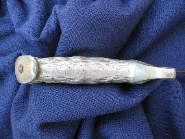 I'm looking for some information on this Knife possibly a Merrill E ...